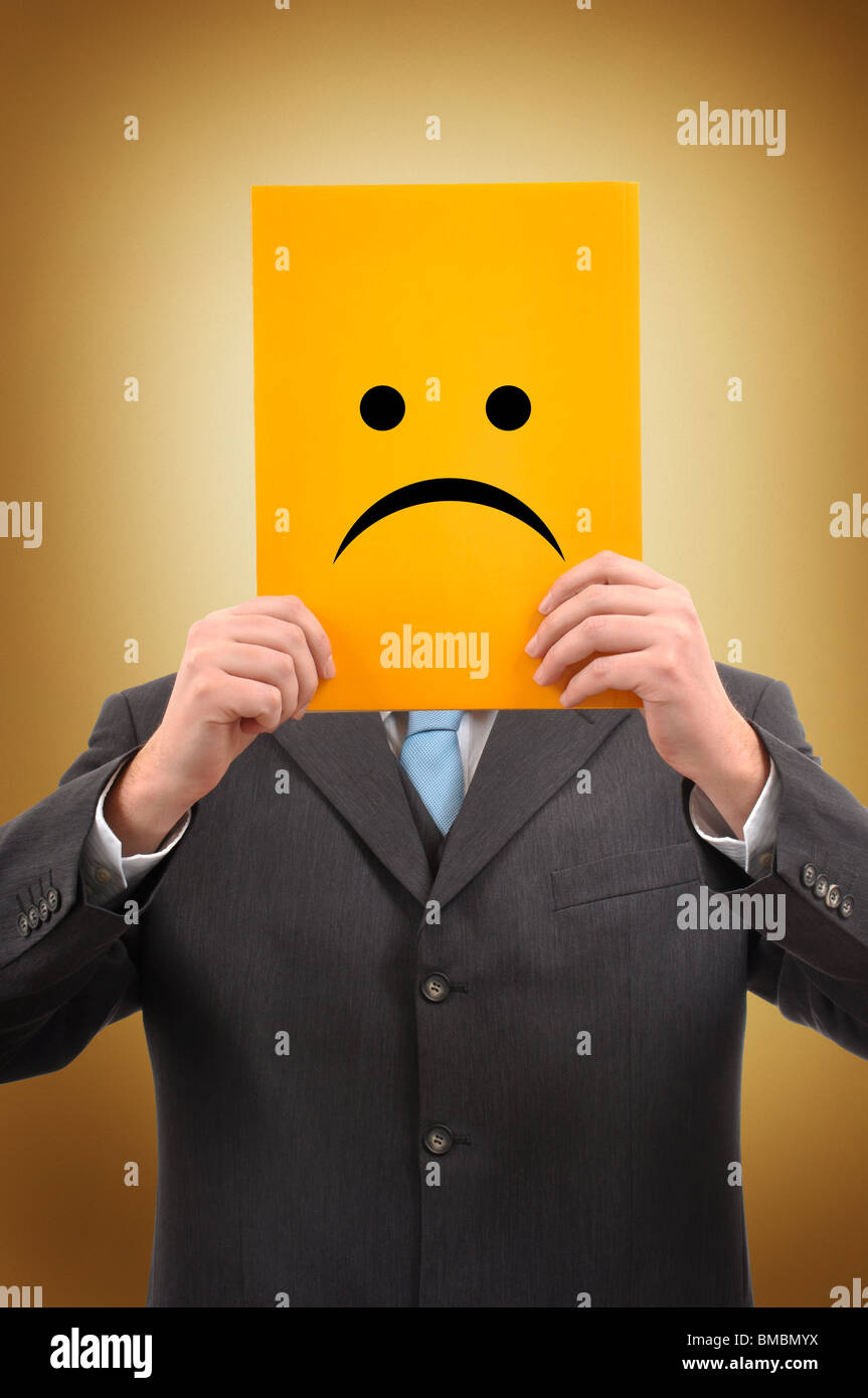 Businessman in gray suite is holding a yellow folder with sad face ...