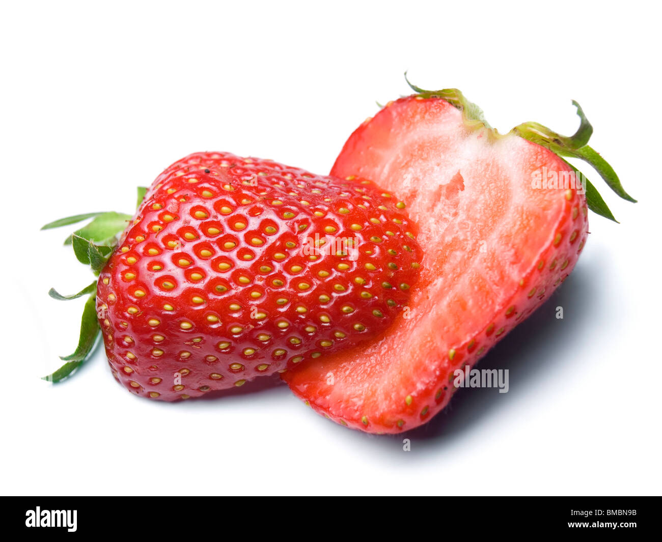 Cross section of a ripe strawberry on a white background Stock Photo ...
