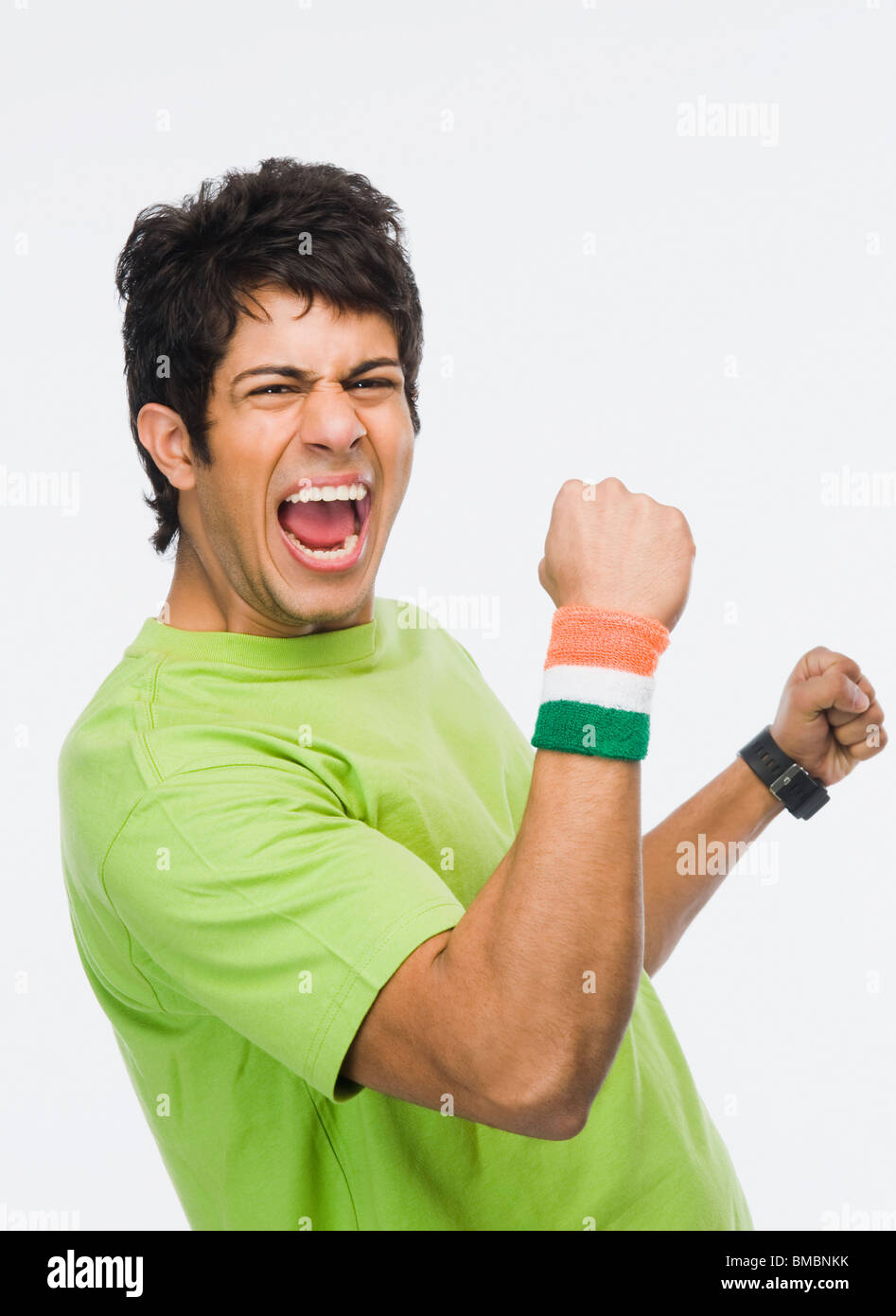 Portrait of a man clenching fist Stock Photo - Alamy