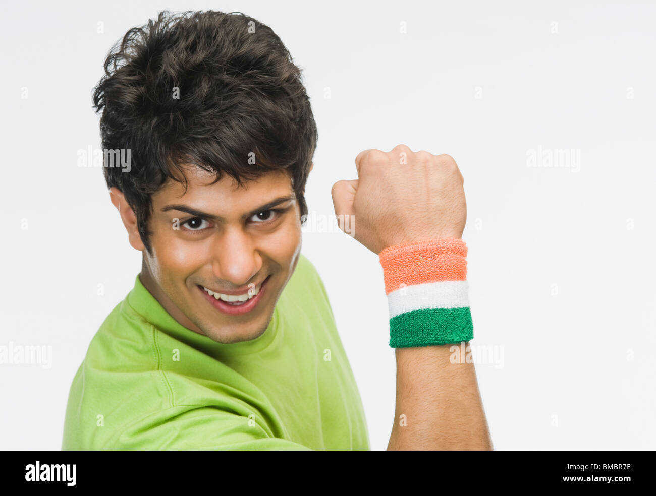 Portrait of a man clenching fist Stock Photo - Alamy