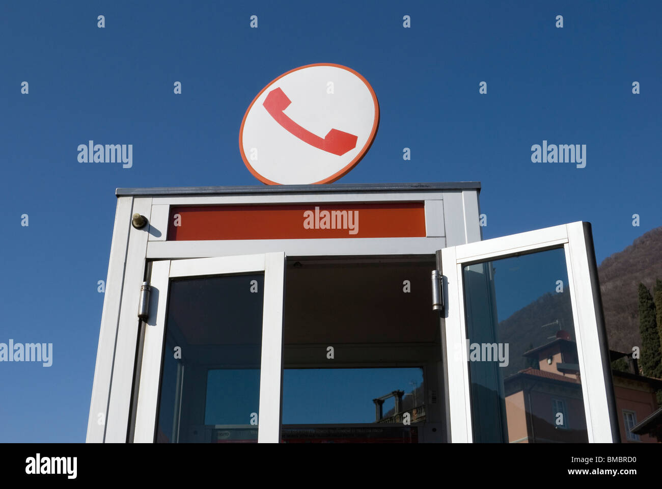 telephone box with open door - Italy Stock Photo - Alamy
