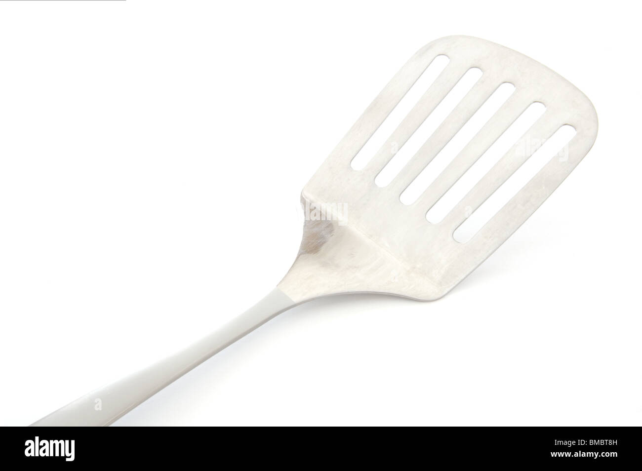 Stainless steel spatula isolated on a white background Stock Photo - Alamy