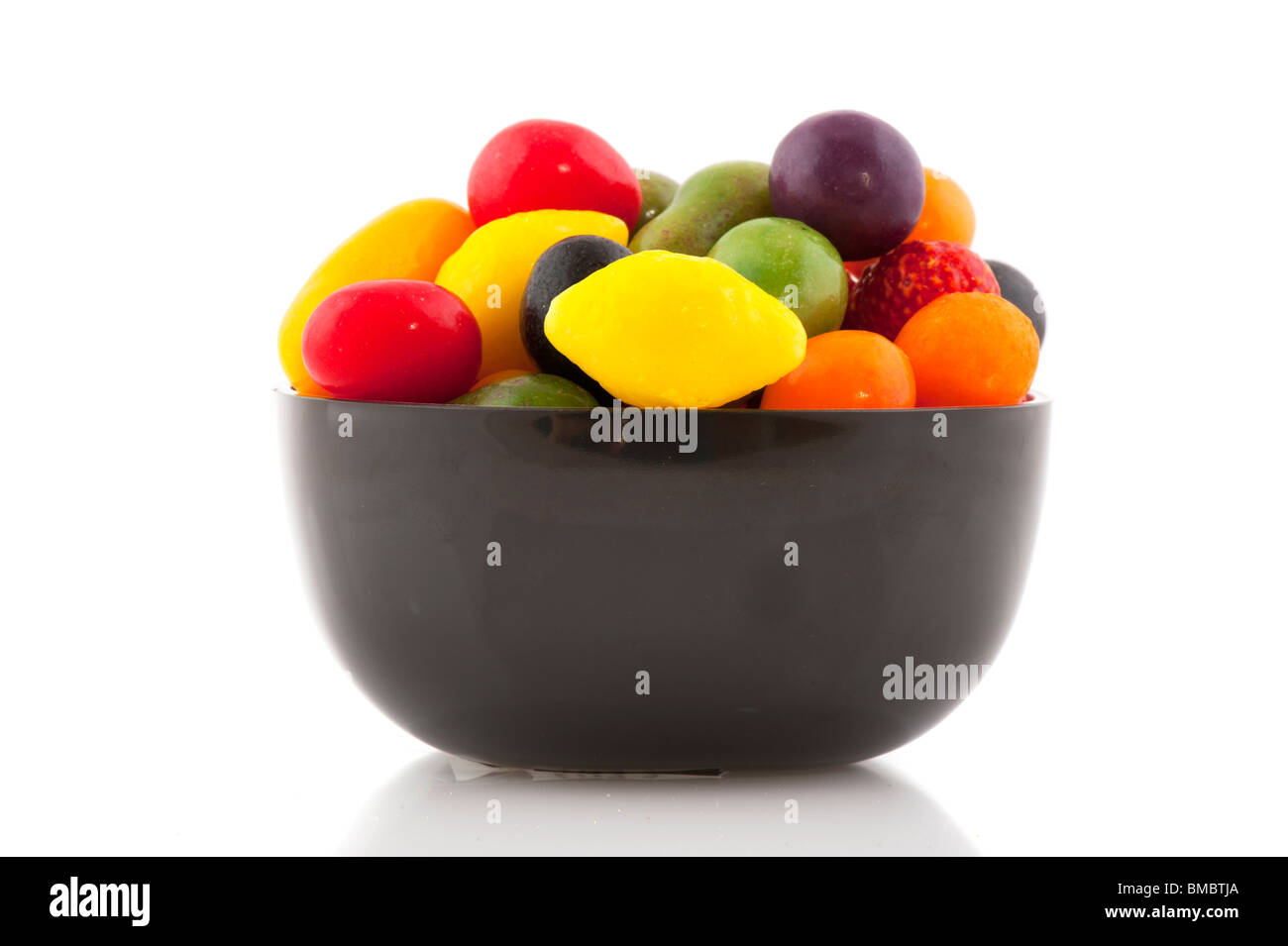 colorful candy in fruit shape with black bowl Stock Photo - Alamy