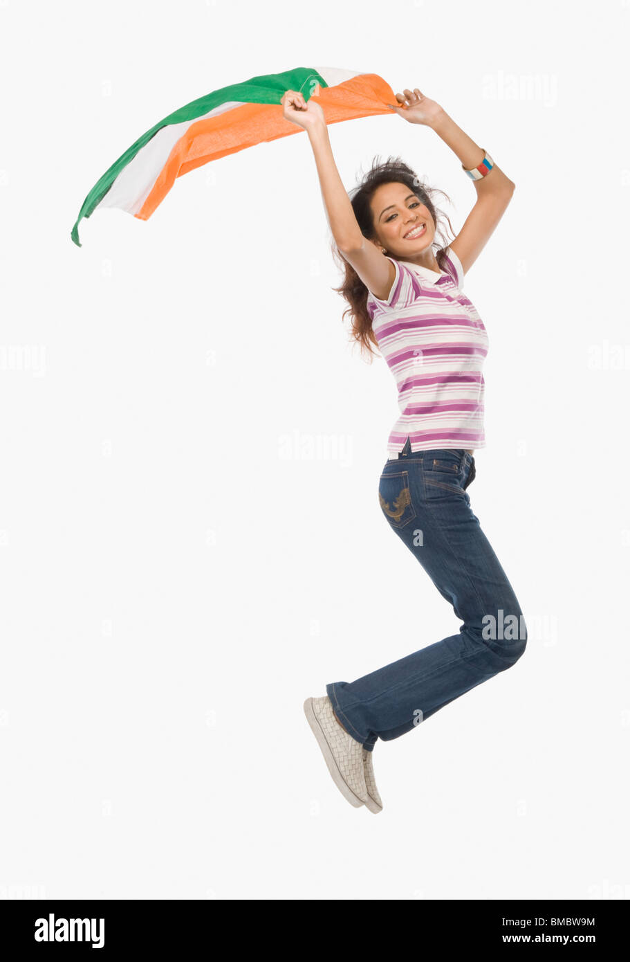 Portrait of a woman jumping with an Indian flag Stock Photo - Alamy