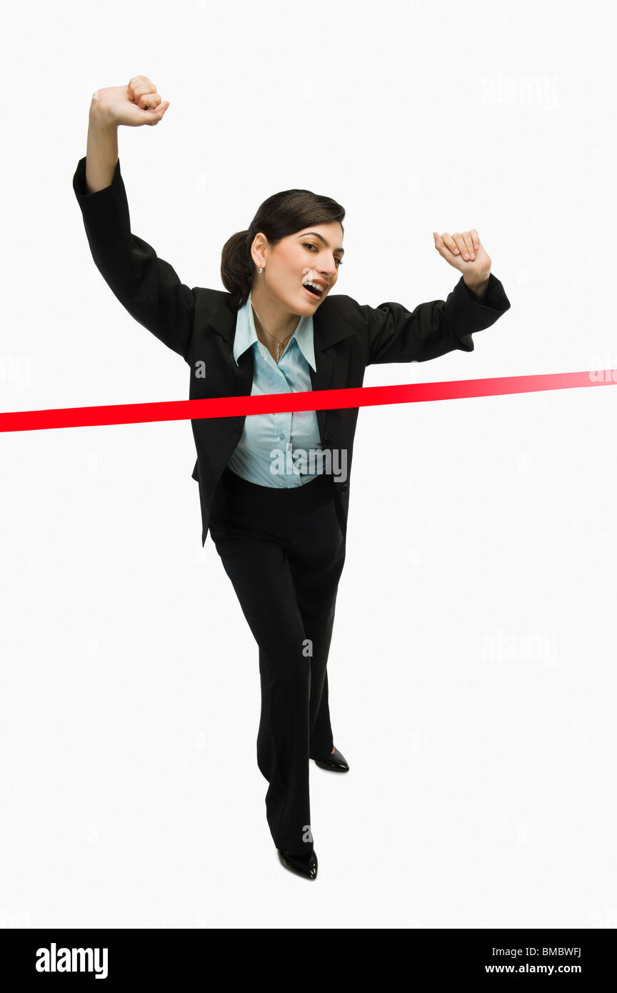 Businesswoman crossing the finishing line Stock Photo - Alamy