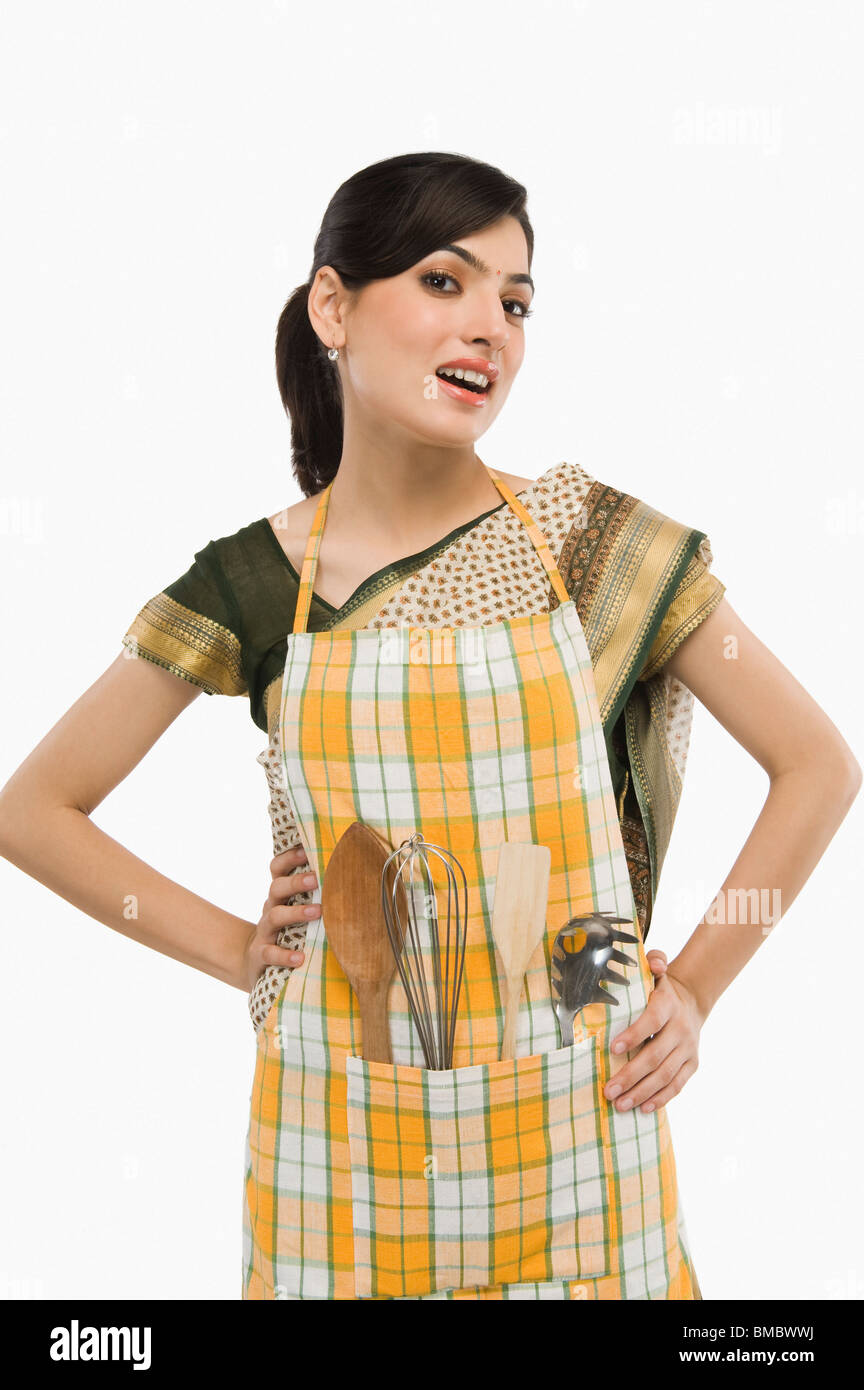 Housewife wearing an apron Stock Photo - Alamy