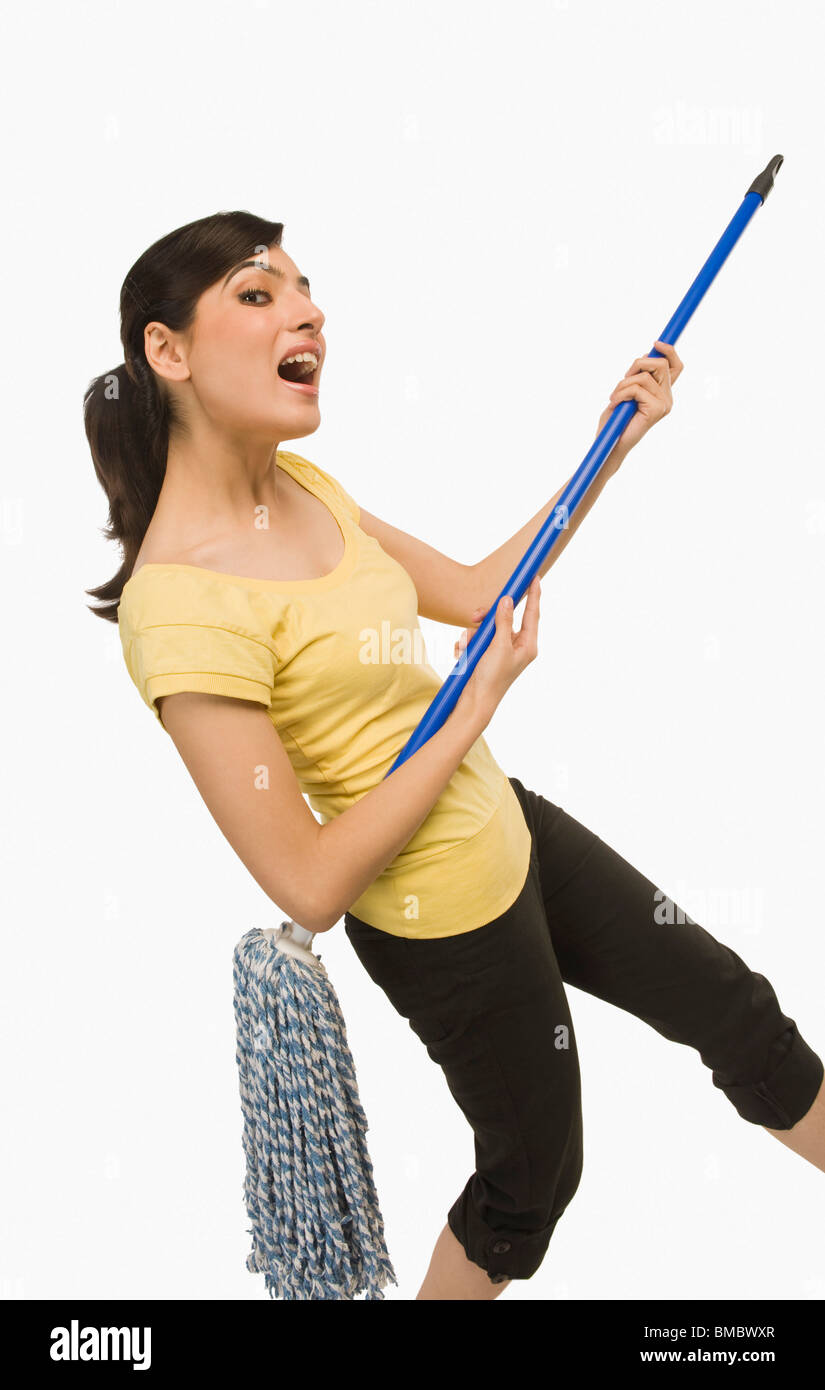 Woman dancing with a mop Stock Photo - Alamy