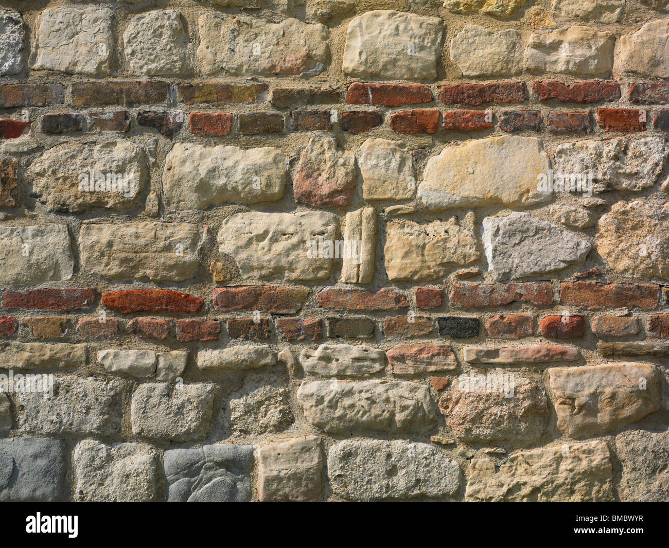 Wall of bricks and rocks, wide and detail Stock Photo - Alamy