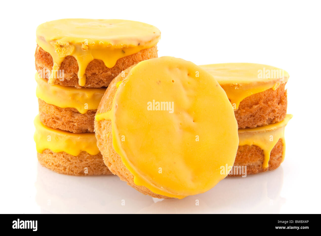 Yellow easter cake stacked on white background Stock Photo - Alamy