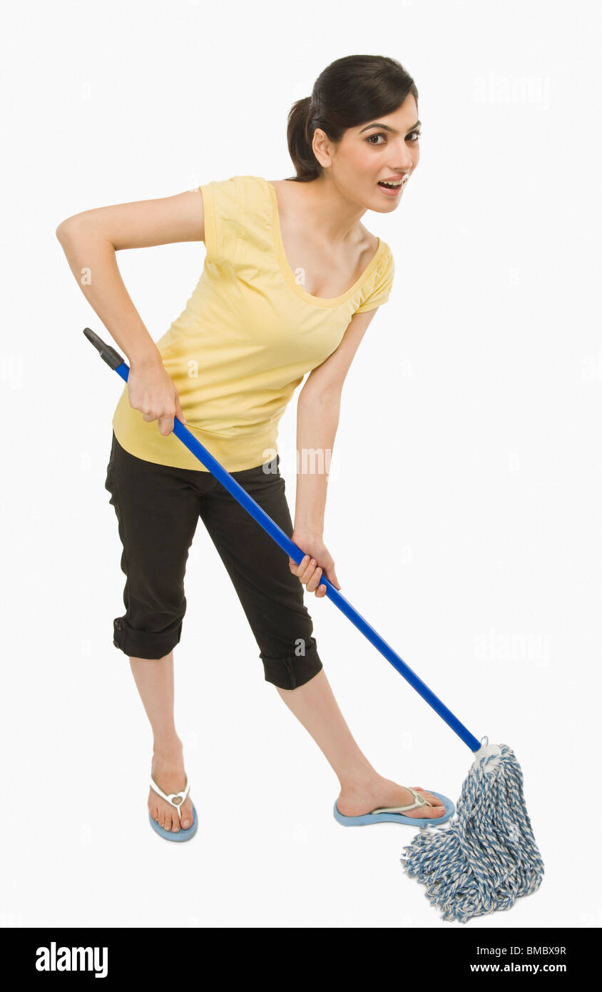 Woman cleaning floor with a mop Stock Photo - Alamy