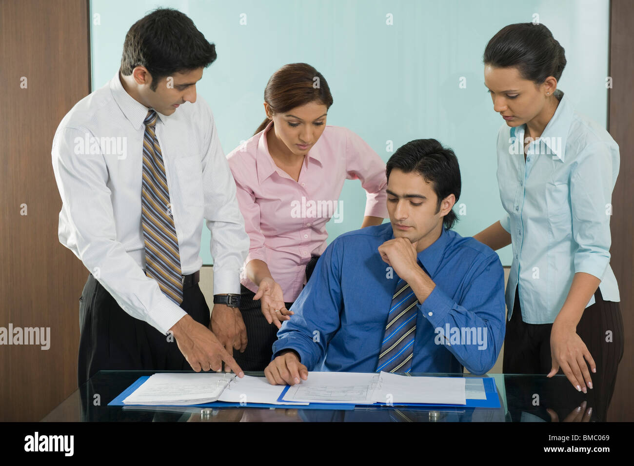 Business executives discussing in a conference room Stock Photo - Alamy