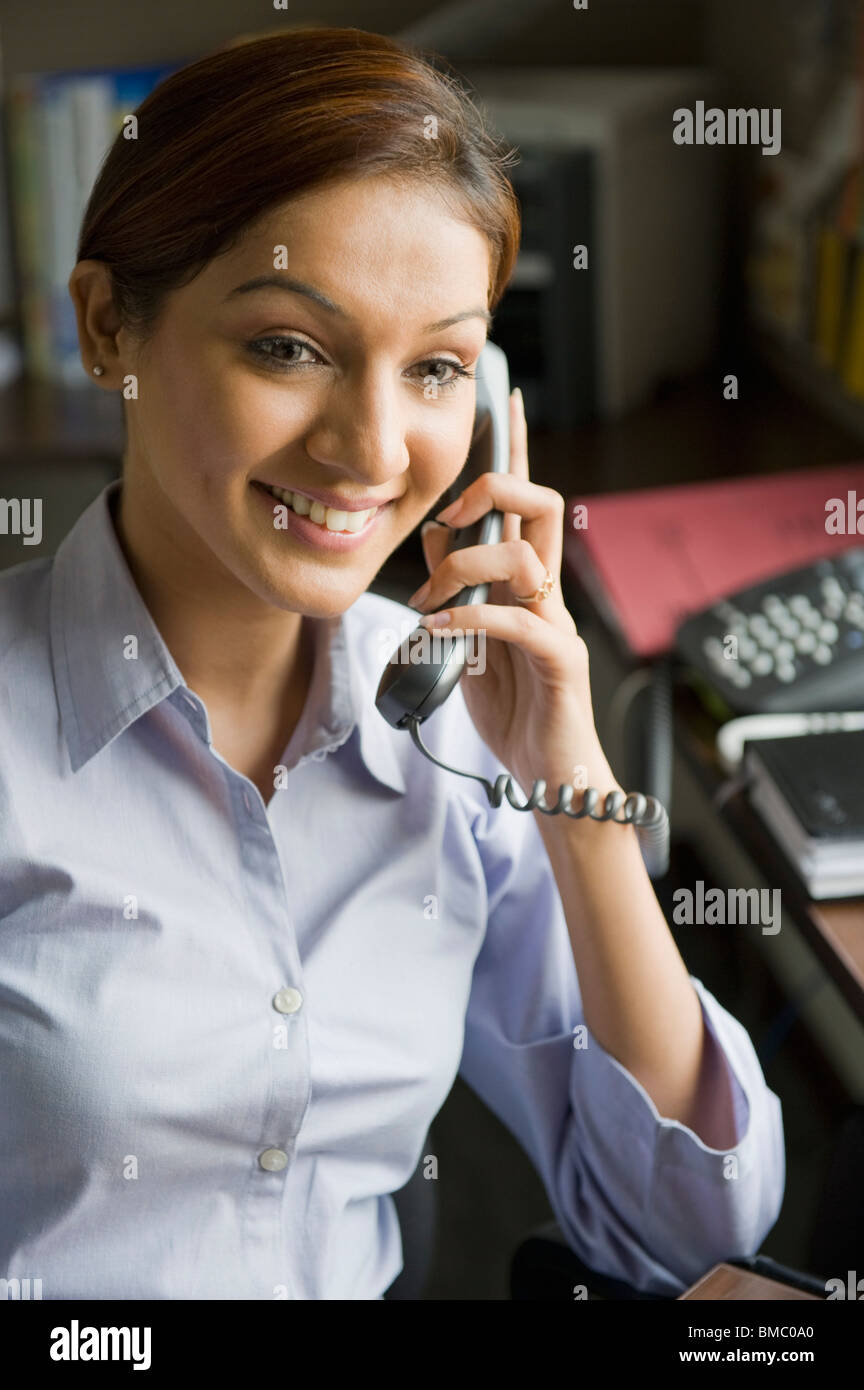 Indian woman talking on landline hi-res stock photography and images ...
