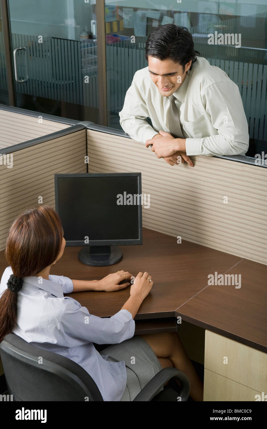 Two business executives talking in an office Stock Photo - Alamy