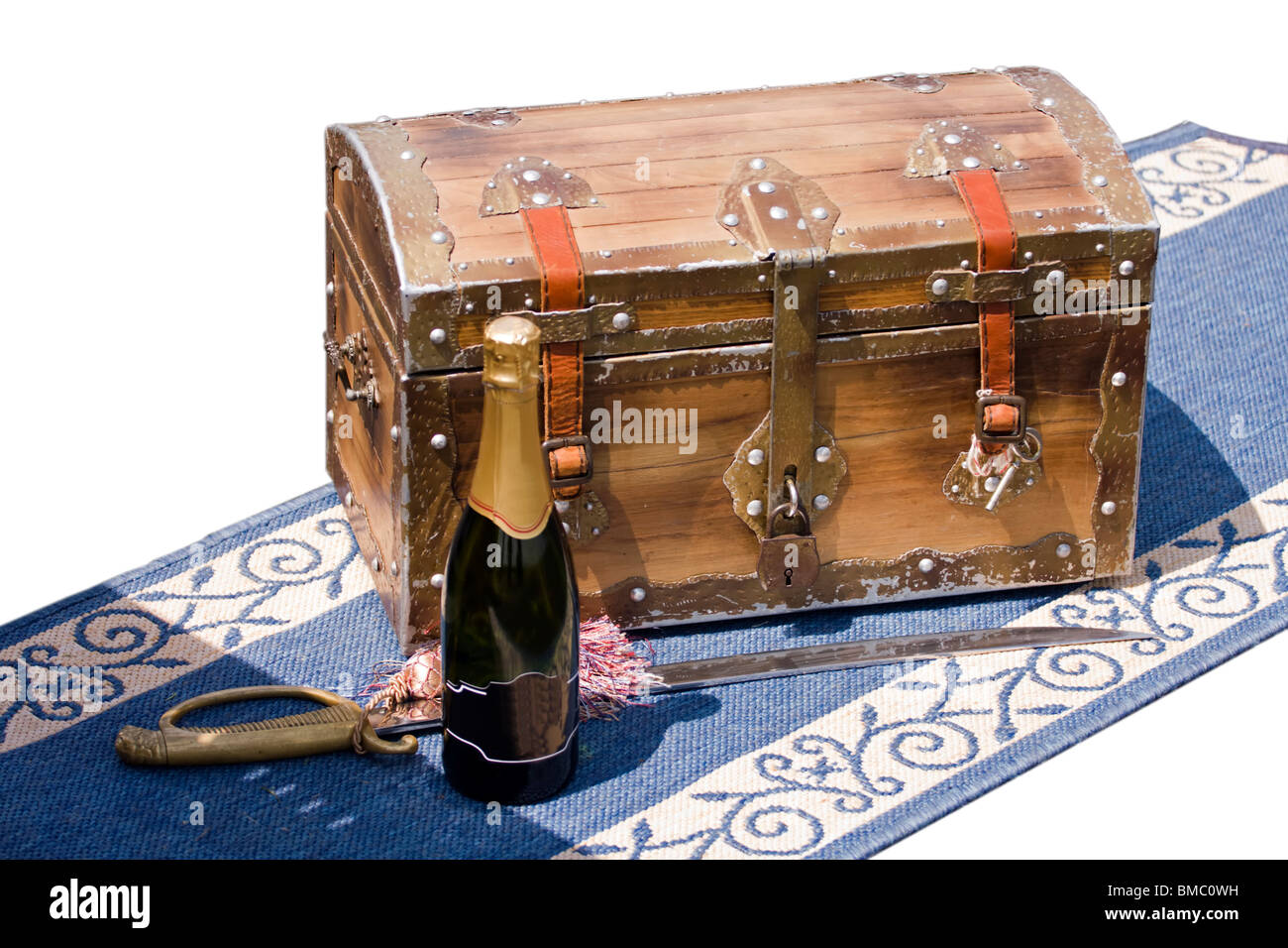 Treasure chest with bottle and sword Stock Photo - Alamy