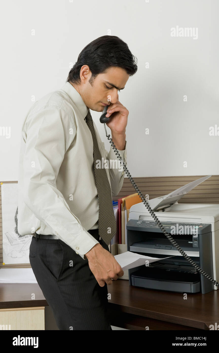 Man reading computer printout hi-res stock photography and images - Alamy