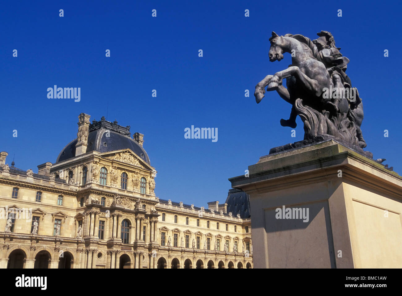 Equestrian statue outside La Louvre art gallery and Museum Paris France ...