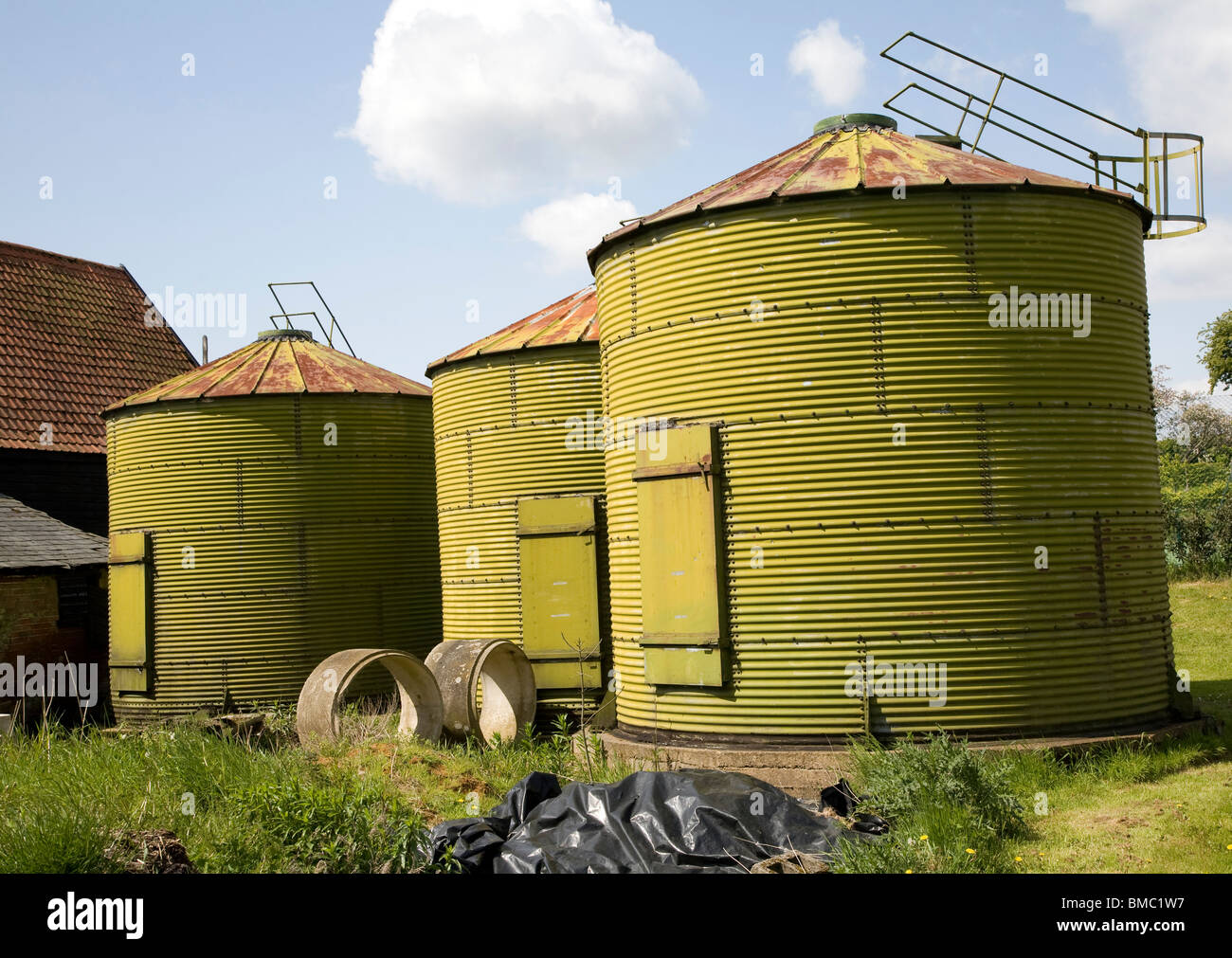 Green sillage storage tanks in farmyard Stock Photo - Alamy