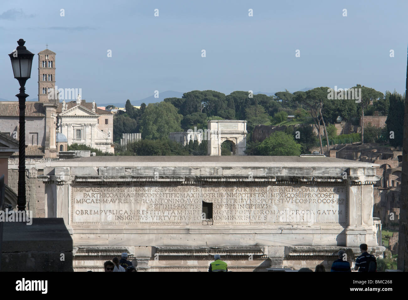 Rome, Italy. Arch of Titus behind the attic of the Arch of Septimius ...