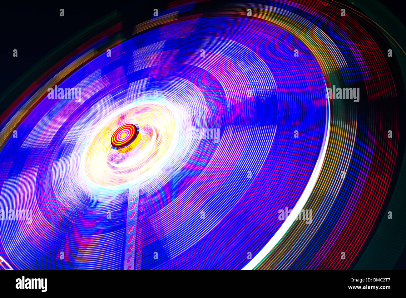 fast merry-go-round by night with great lights Stock Photo - Alamy