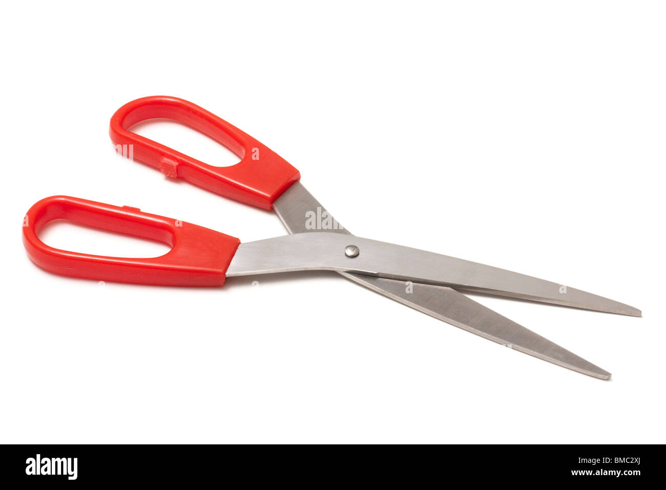 Red handled scissors isolated on a white background Stock Photo - Alamy