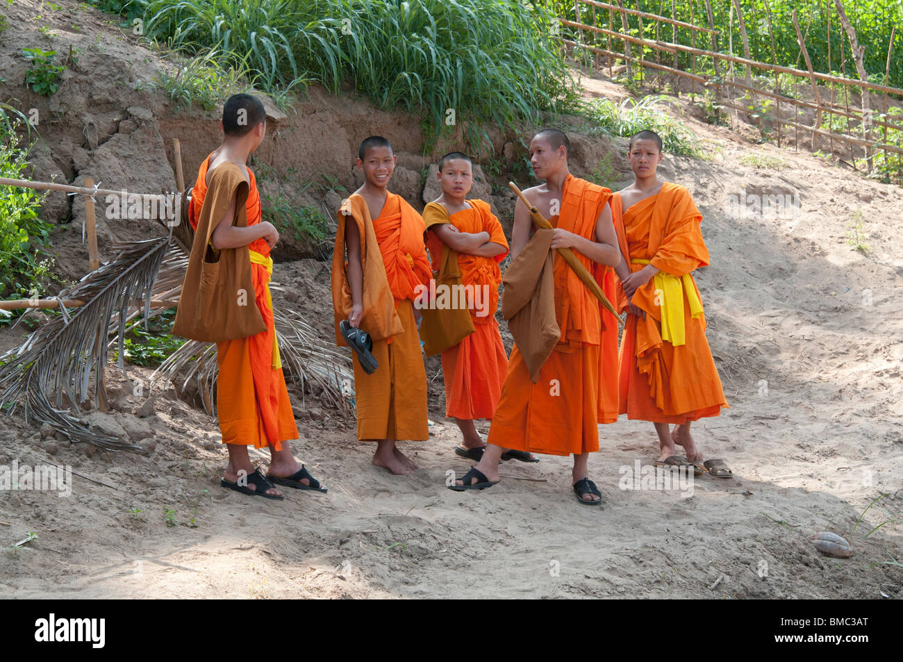 Buddhist monks on the banks of the Mekong river Luang Prabang Laos ...