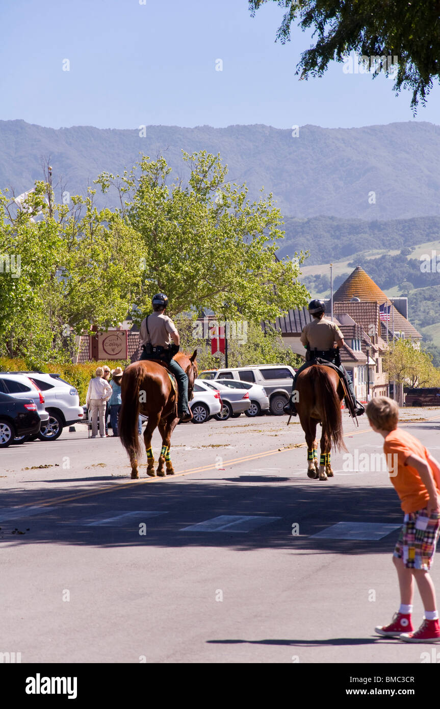 Boy Looking at Mounted Police on horses, Solvang, California, USA Stock ...