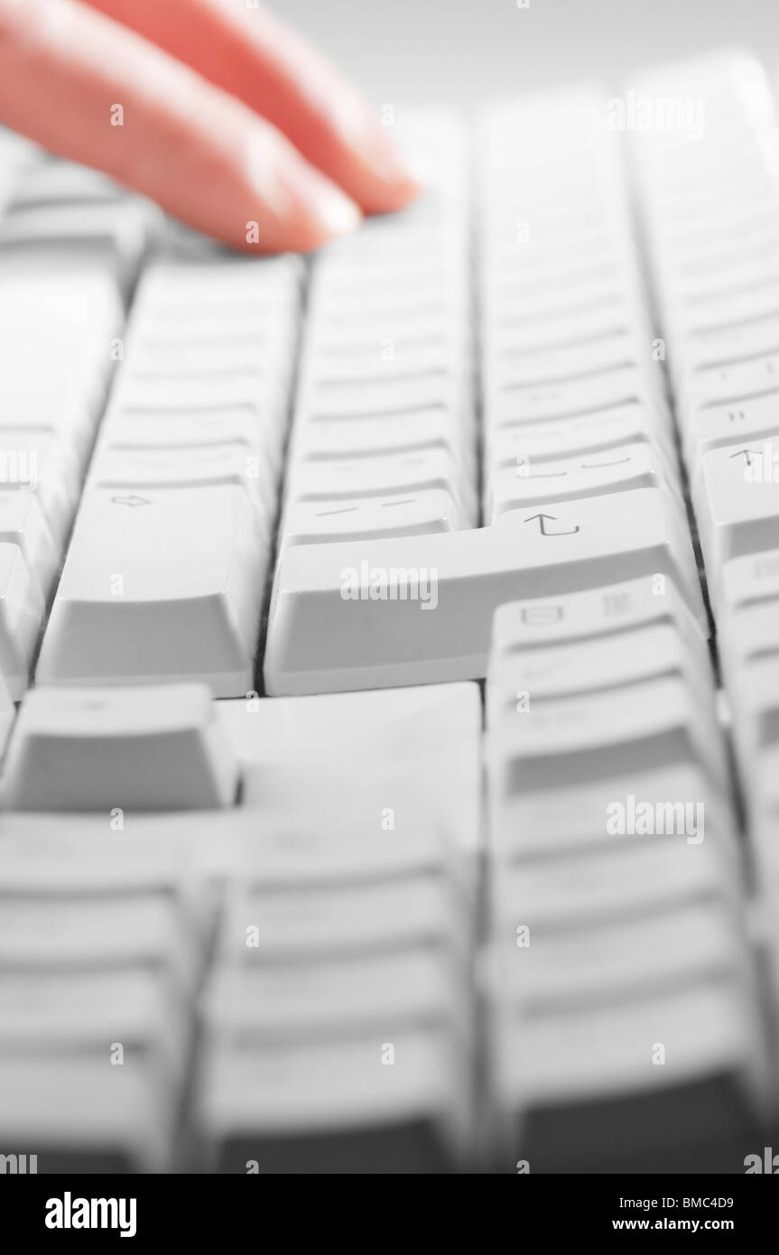 Worker typing on computer keyboard entering data Stock Photo - Alamy