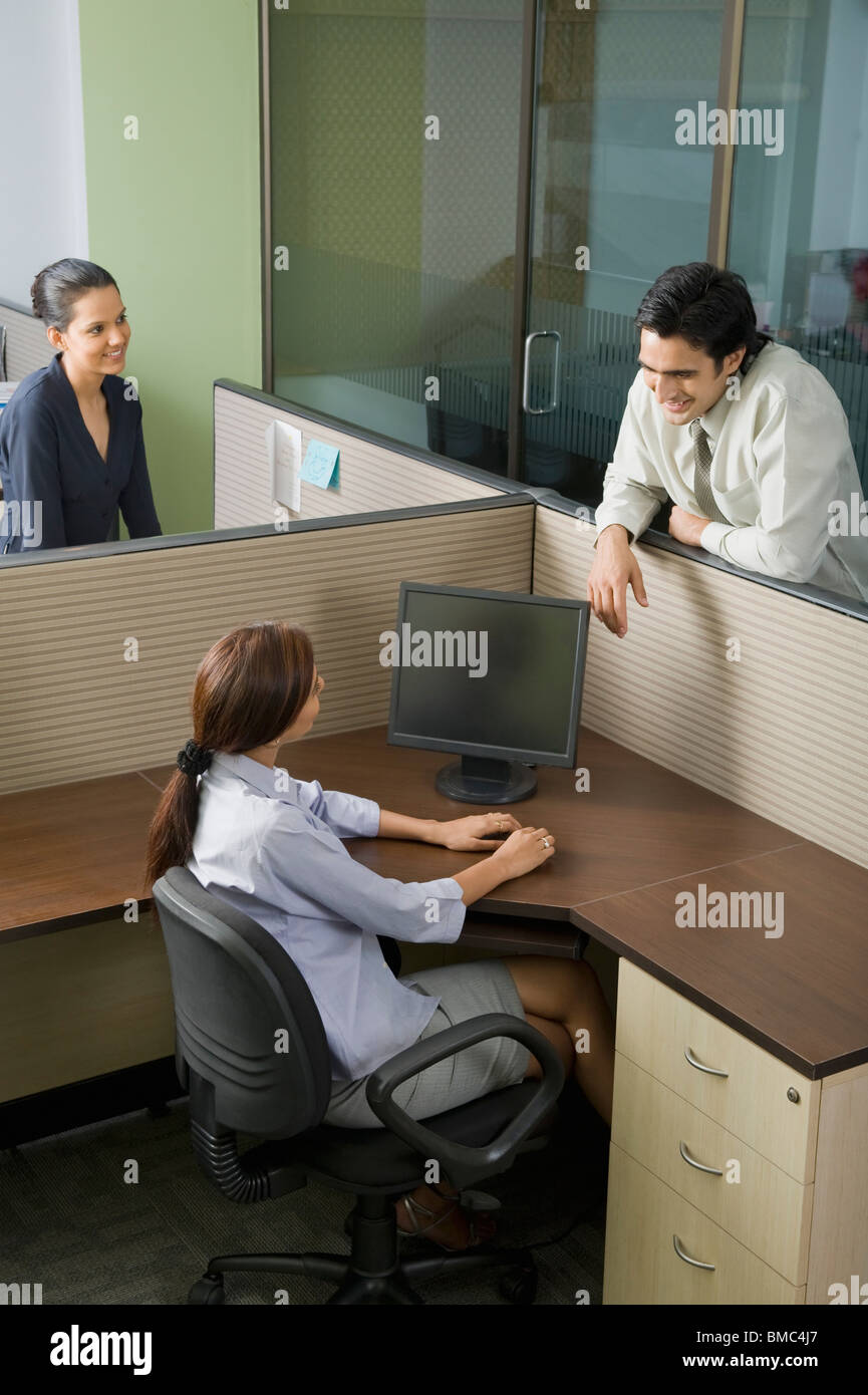 Three business executives talking in an office Stock Photo - Alamy