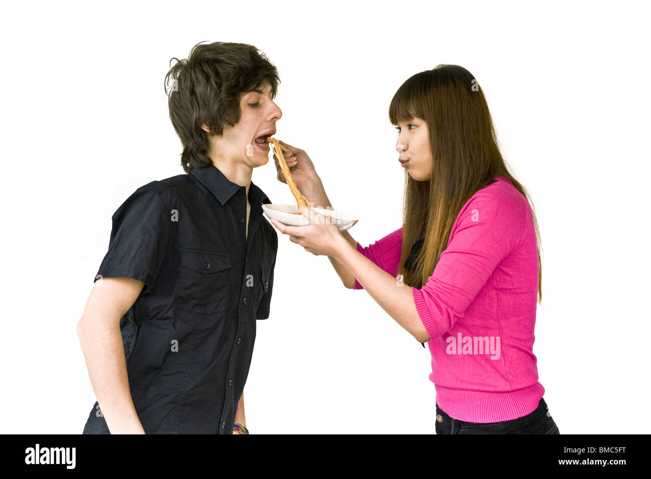 Engaged who eat spaghetti Stock Photo - Alamy