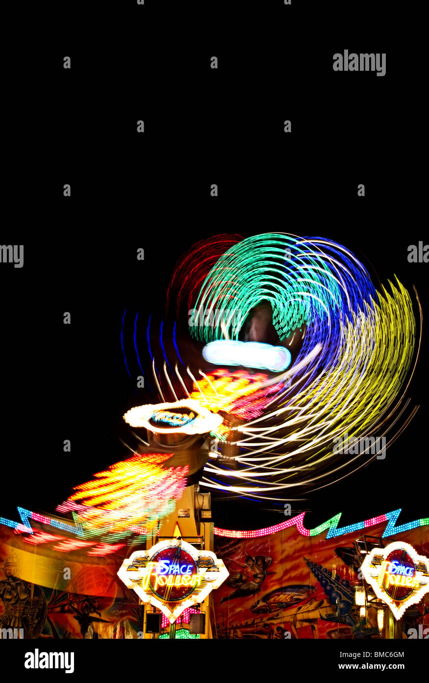 fast merry-go-round by night with great lights Stock Photo - Alamy