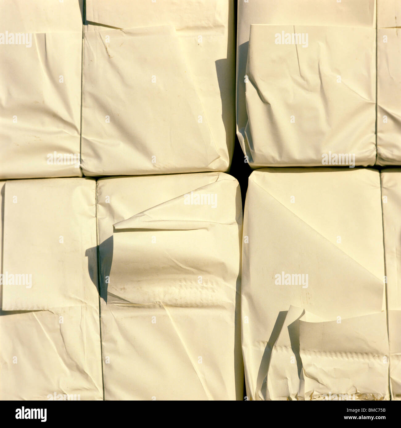 Closed cardboard boxes stacked together, revealing wrinkled wrapping at ... Closed cardboard boxes stacked together, revealing wrinkled wrapping at ...