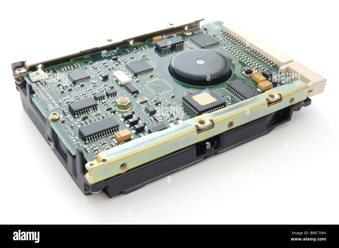 Computer hard disk drive circuit board isolated on a white background ...