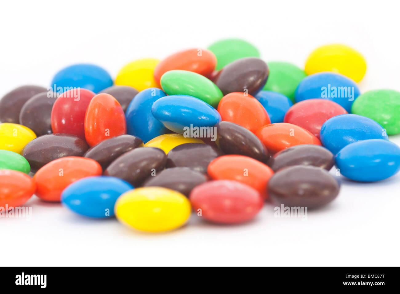 Multi-colored candy isolated on a white background Stock Photo - Alamy