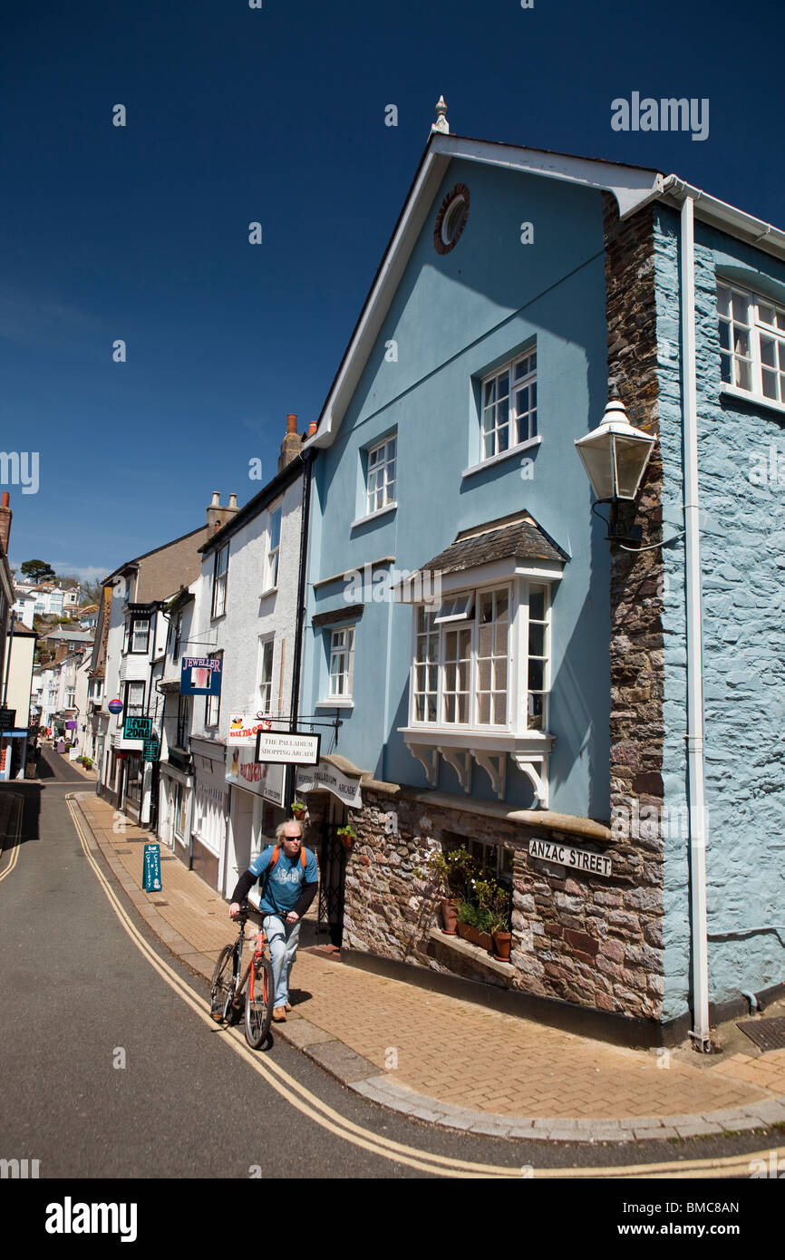 UK, England, Devon, Dartmouth, Anzac Street, man pushing bike in ...