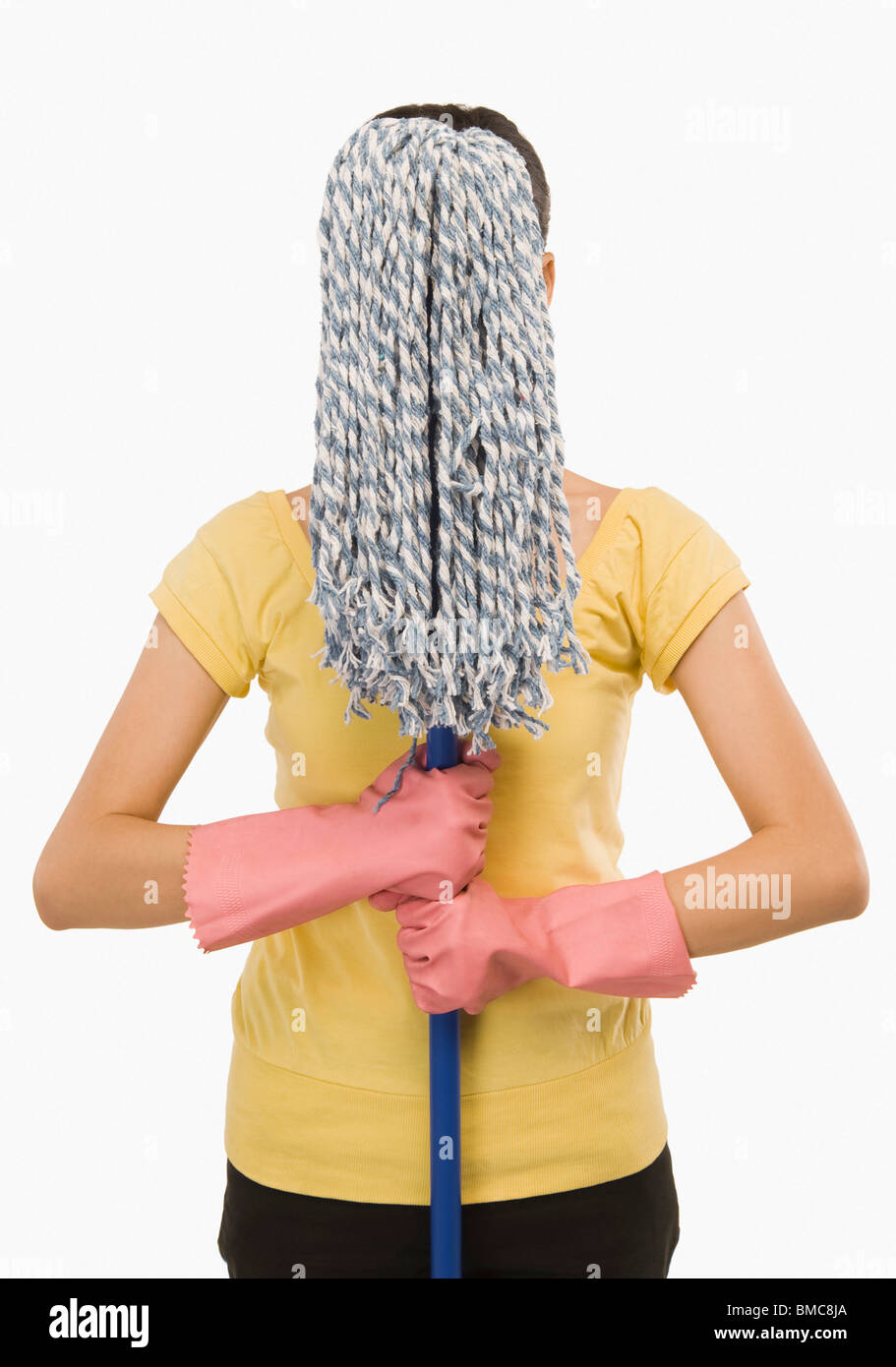Woman hiding her face with a mop Stock Photo - Alamy