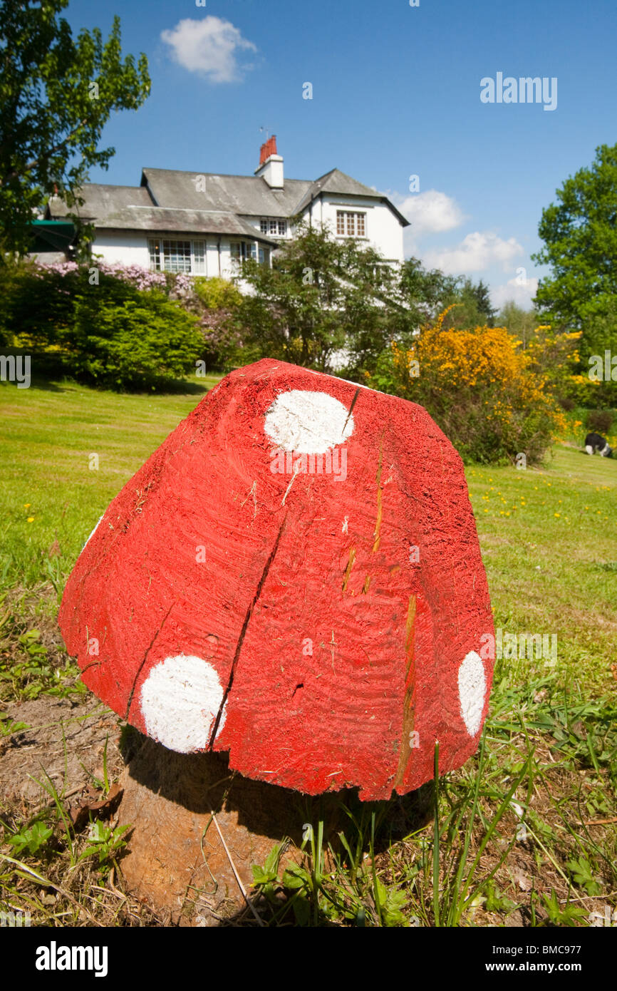 A wooden toadstool in a large private house and gardens near Tarn Howes ...