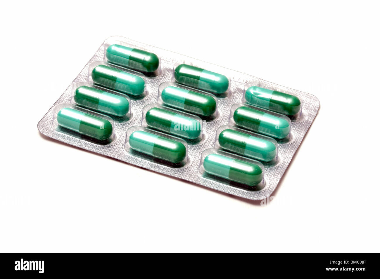Capsules isolated on white Stock Photo - Alamy