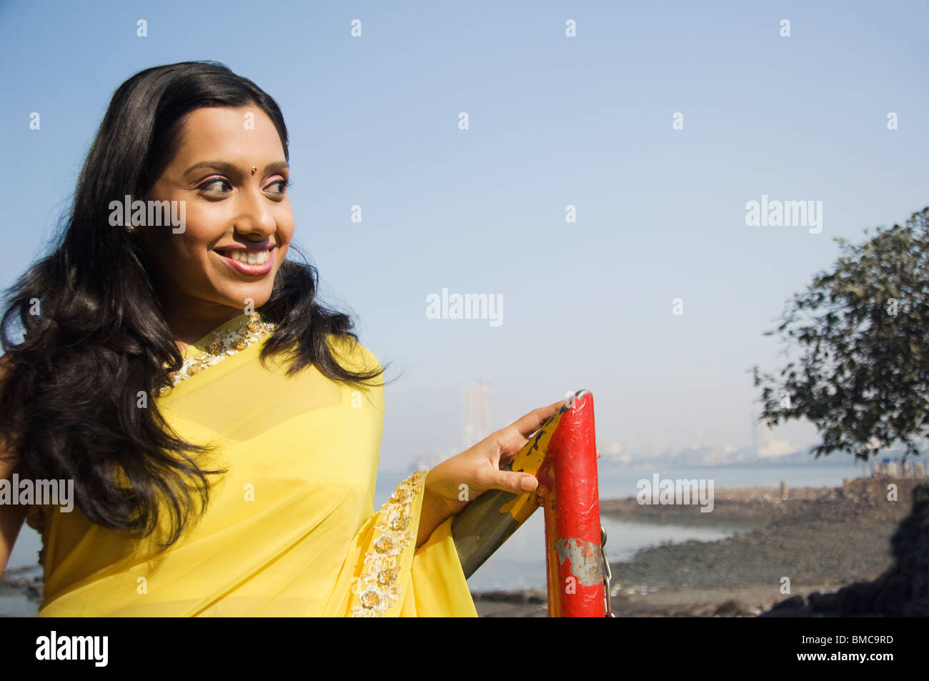 Woman standing near a beach, Mumbai, Maharashtra, India Stock Photo - Alamy