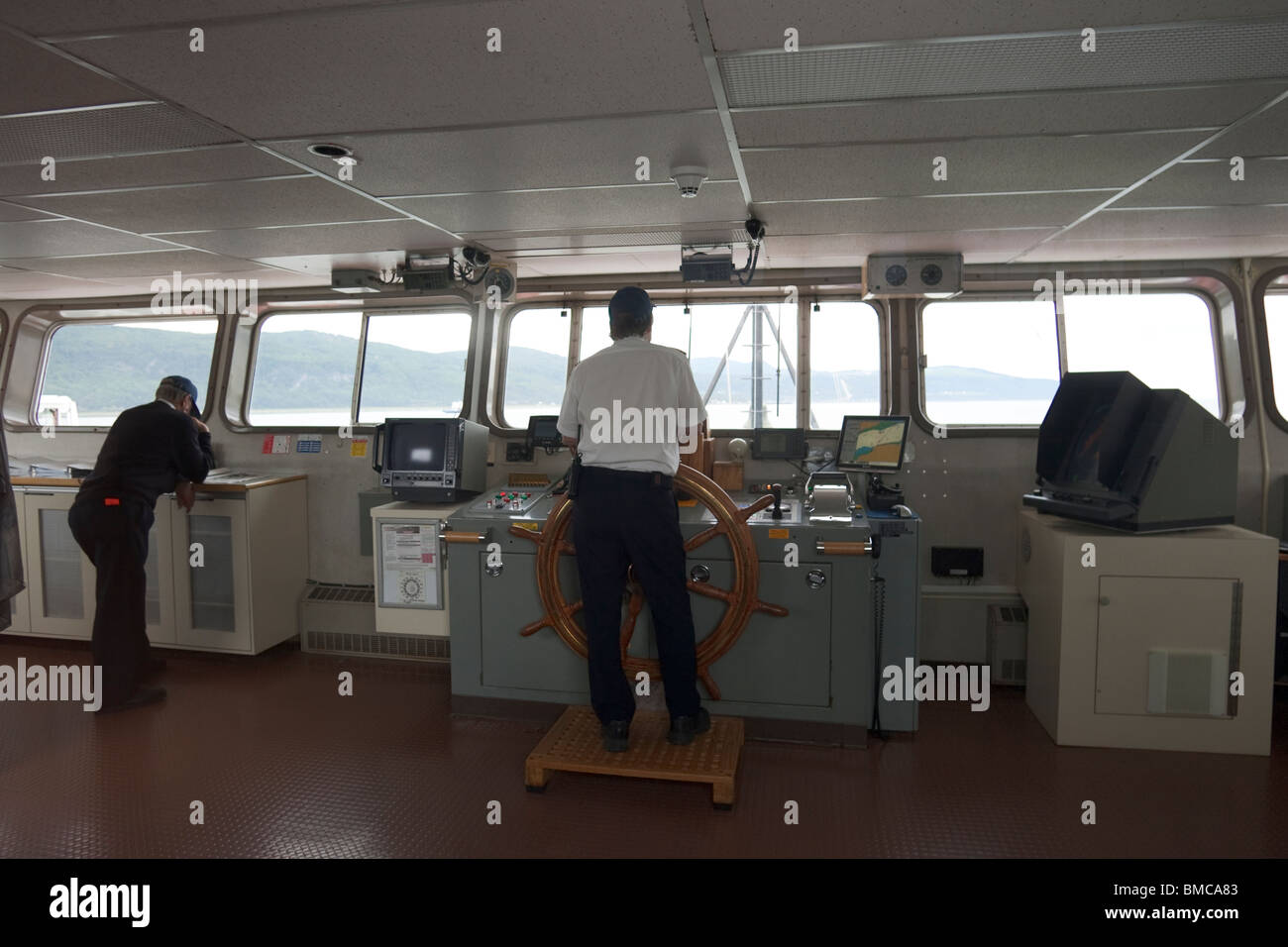 The captain and navigation officer on the bridge of the car ferry Stock ...