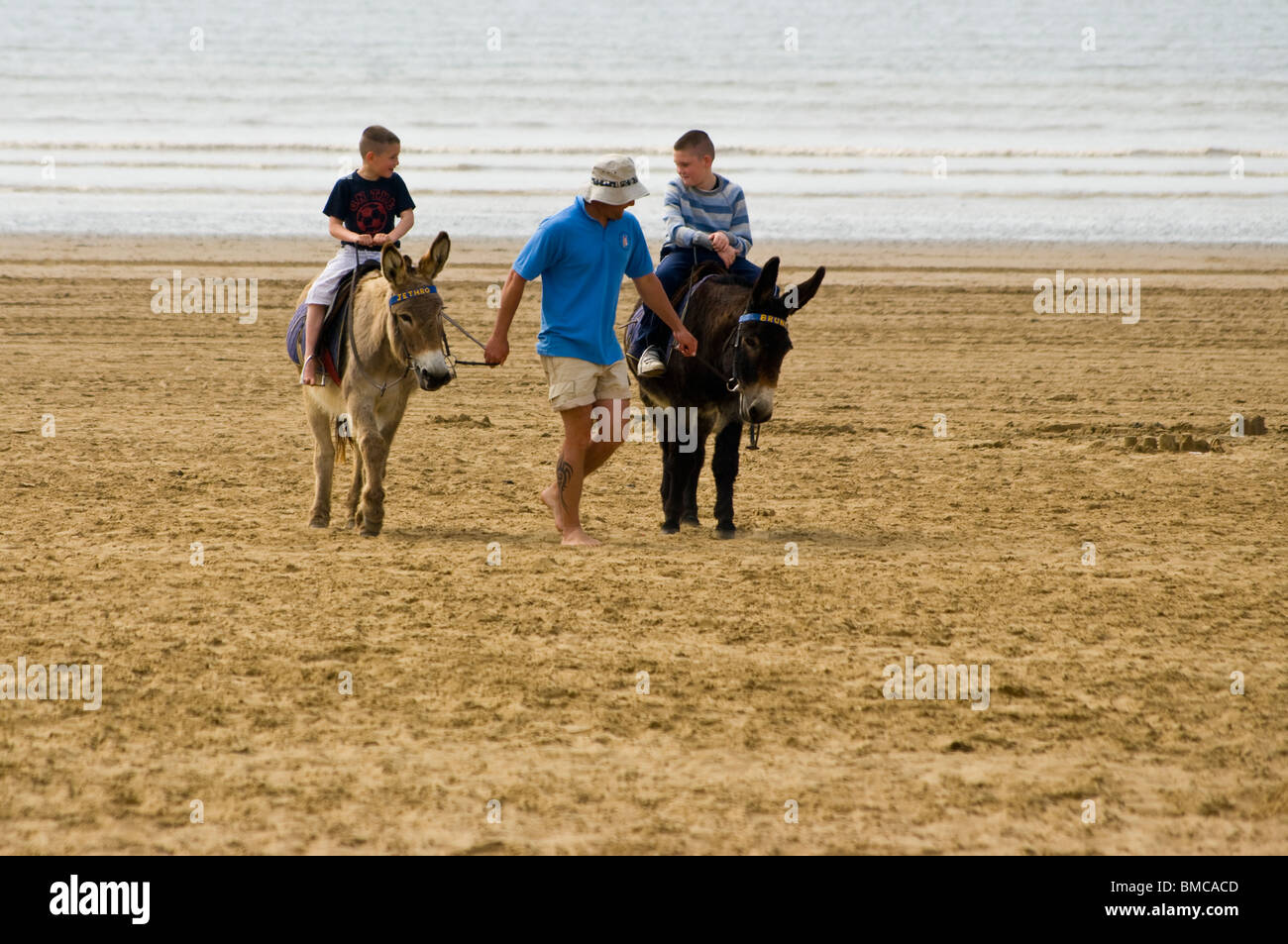 Boys on donkeys hi-res stock photography and images - Alamy