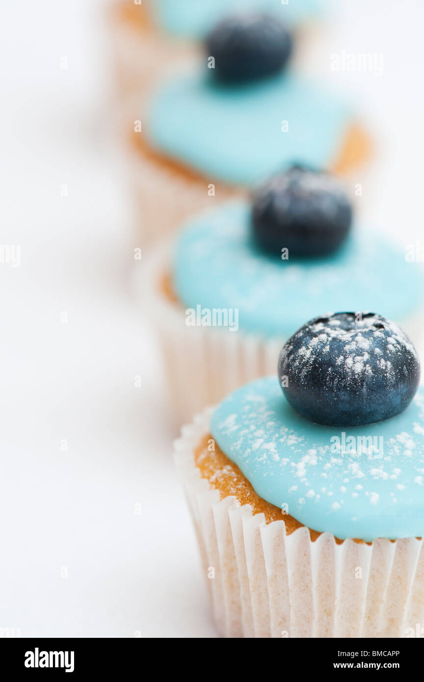 Colourful blueberry mini fruit cupcakes on a white background Stock ...