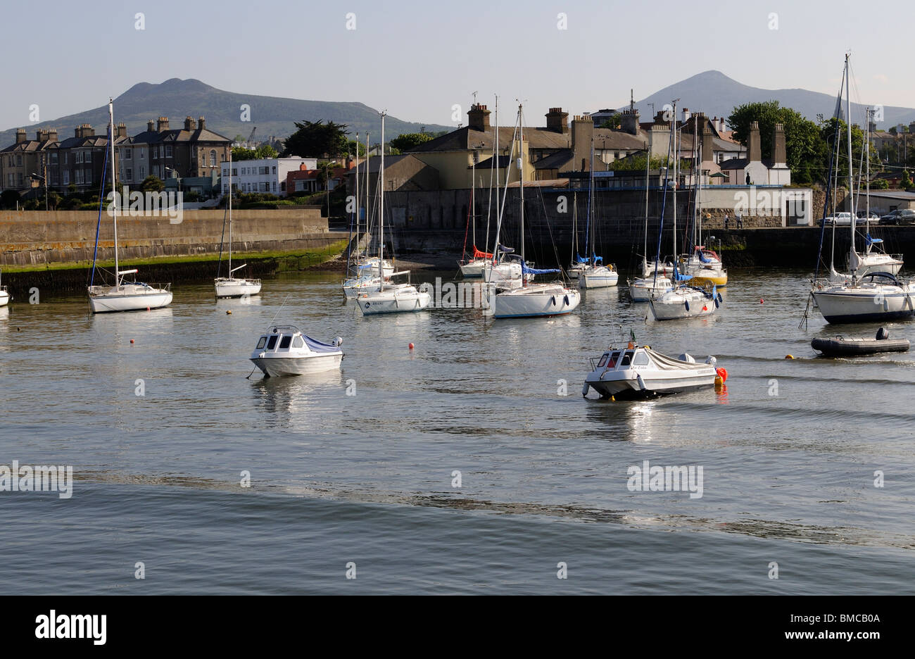 The Bray Harbour with a backdrop of mountains in County Wicklow ...