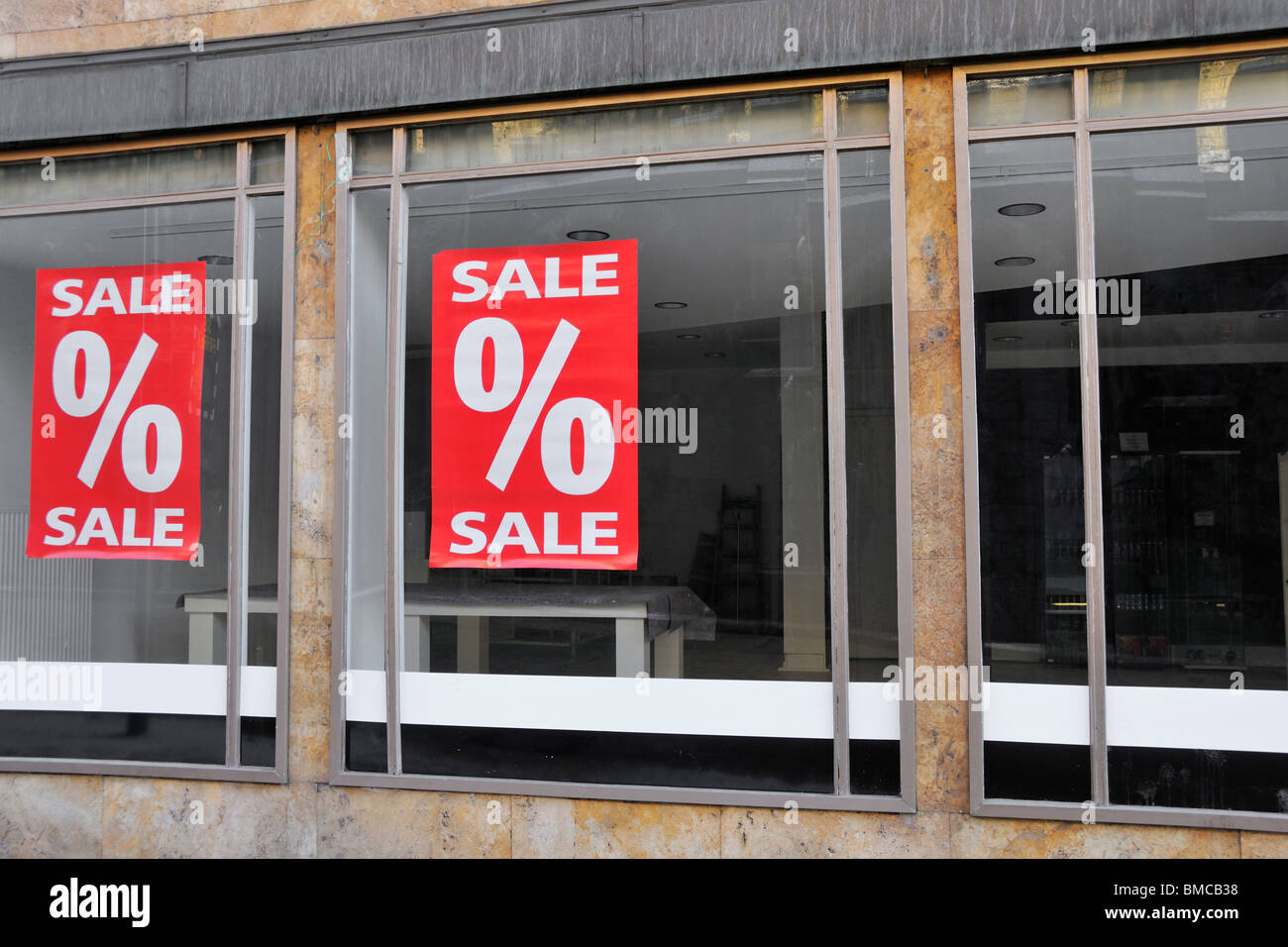 Shop window with signs Sale Stock Photo - Alamy