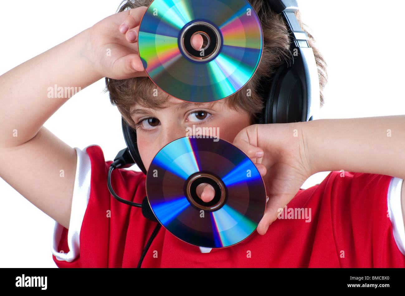 Boy listening music with cd-rom´s Stock Photo - Alamy