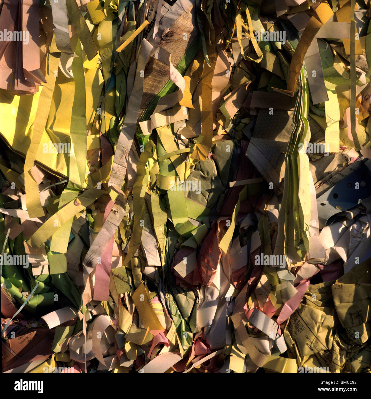 Colorful layers of shredded paper create an abstract texture in outdoor ...