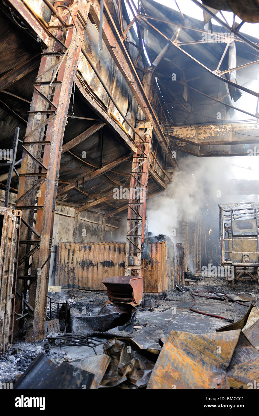 Twisted steel girder from heat of factory fire Stock Photo - Alamy