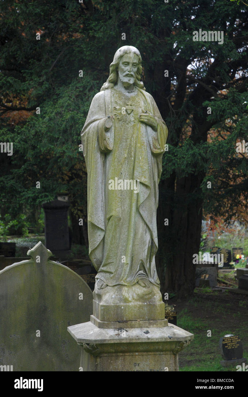 A statue of Jesus in an English cemetery Stock Photo - Alamy