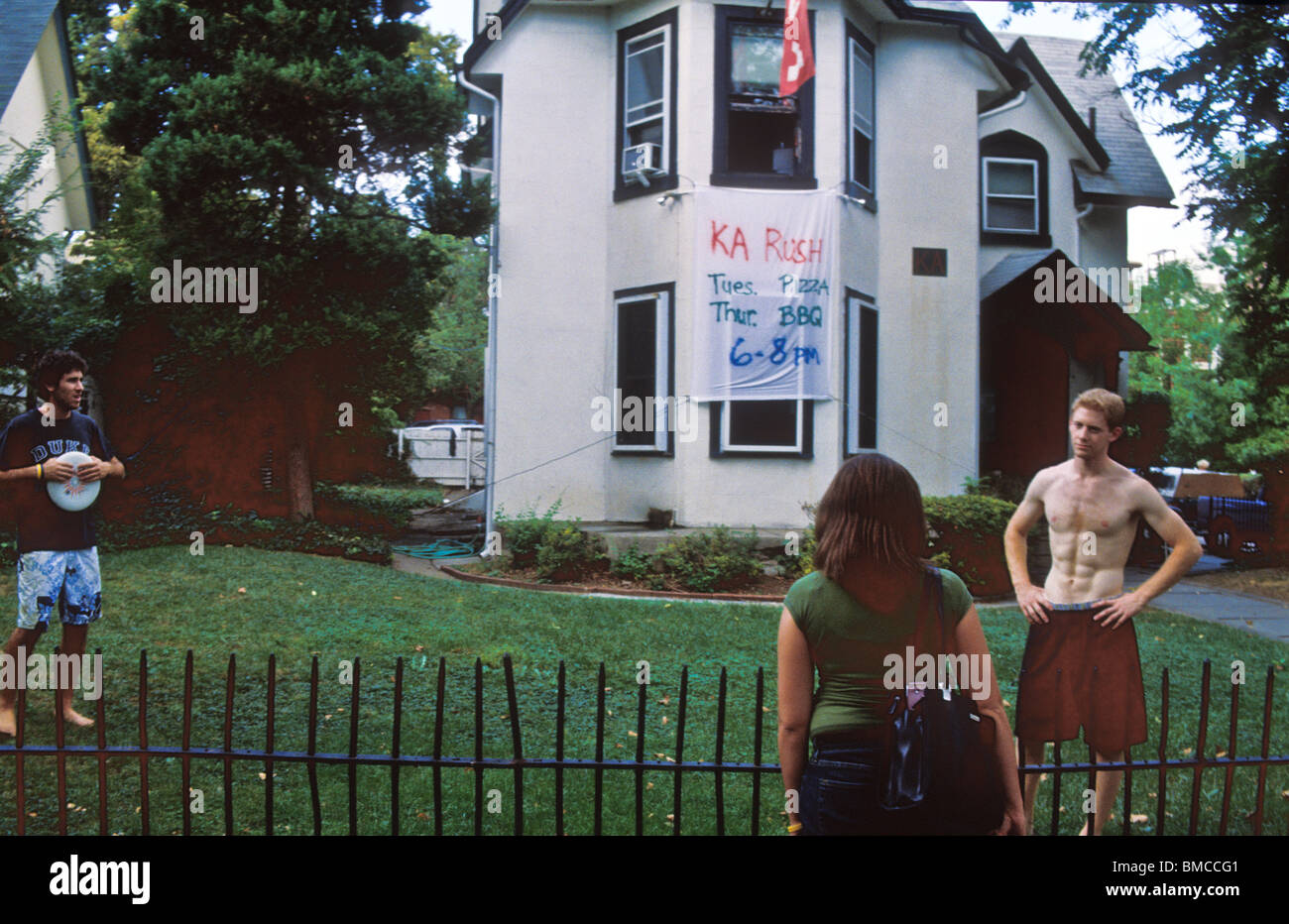 Two fraternity men talk to fellow University student Kappa Alpha Stock ...