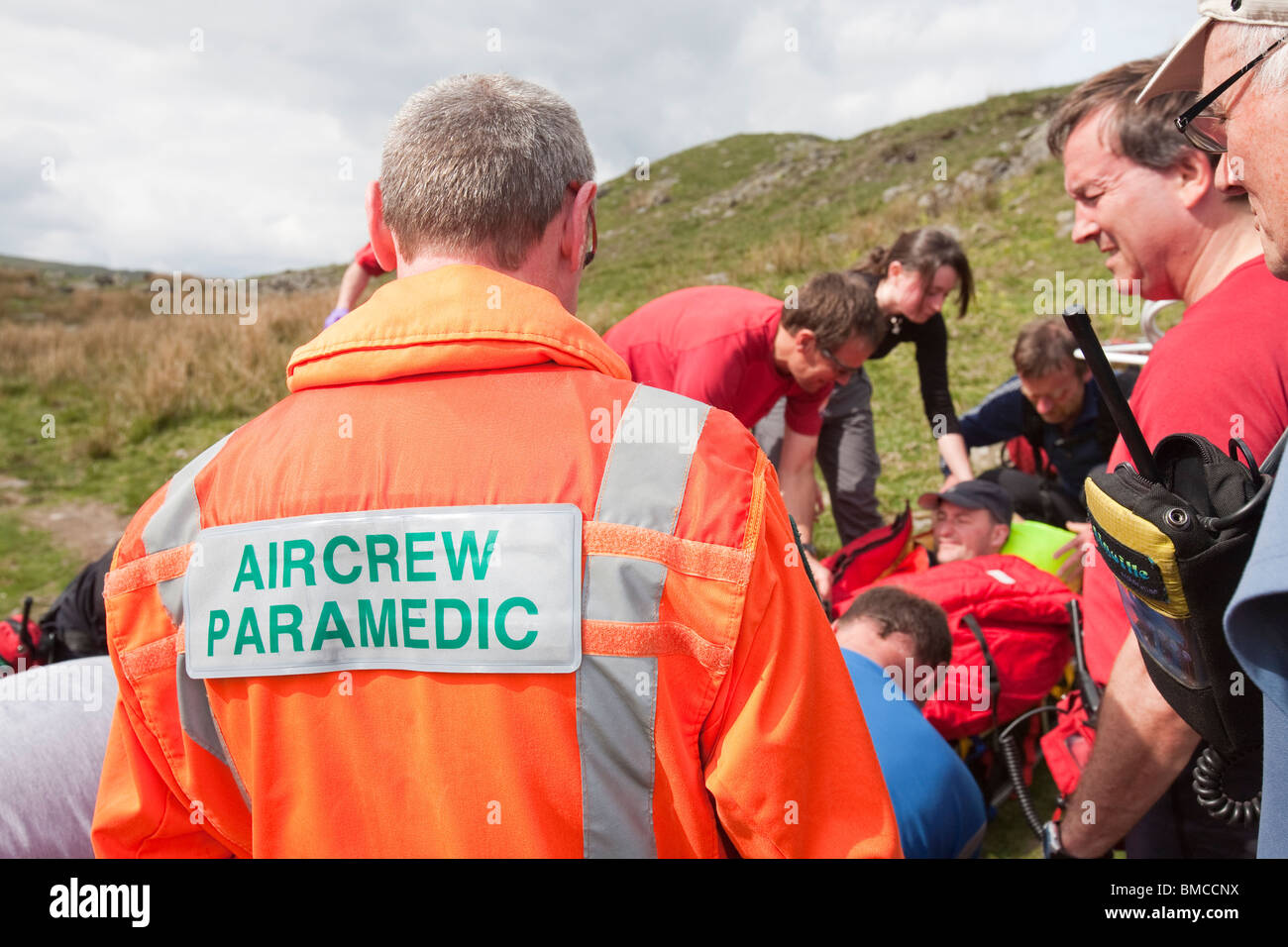 A man with a leg injury is stretchered by members of the Langdale ...