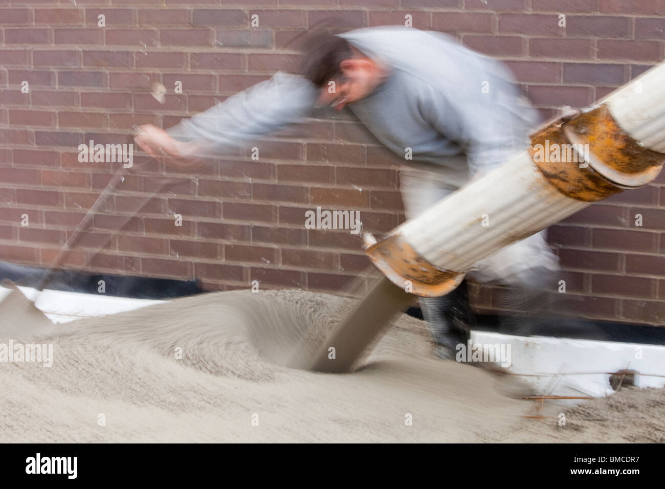 Pouring concrete for the floor of a house extension, Ambleside, UK ...